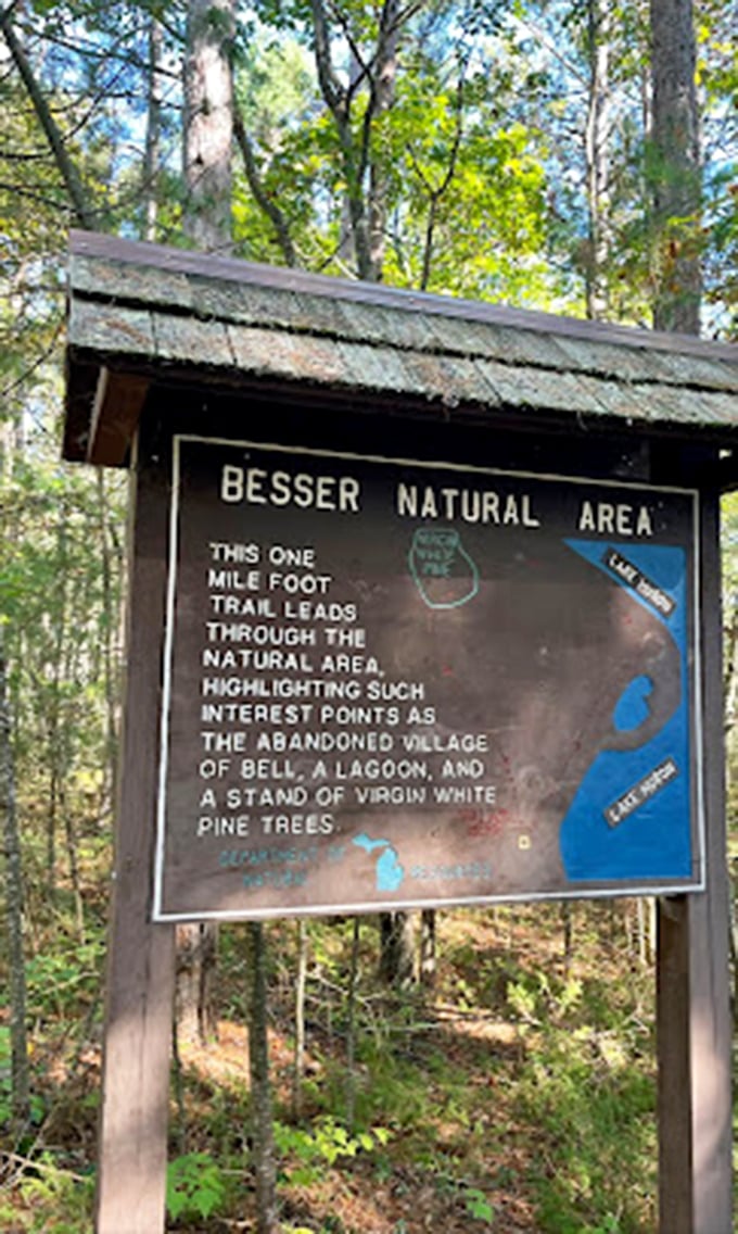 This trail marker promises adventures through a natural area highlighting an abandoned village, a lagoon, and virgin white pines.