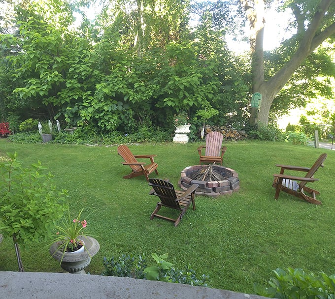 The backyard fire pit where ghost stories become even more convincing after dark.