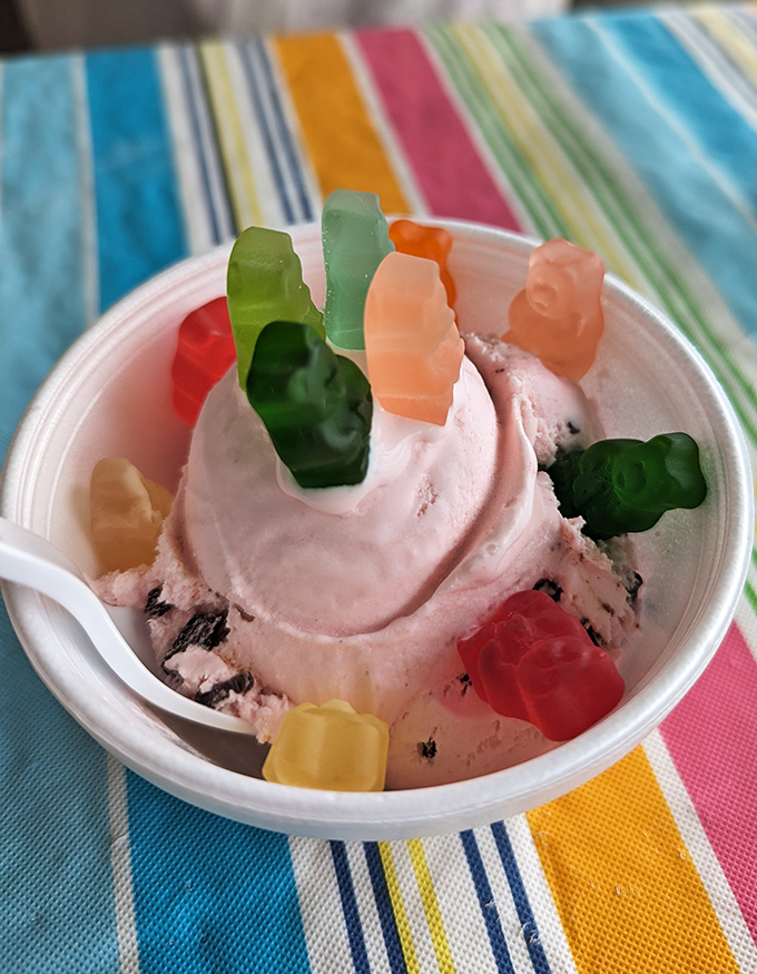Gummy bears standing guard atop a scoop of ice cream &ndash; childhood joy transformed into a dessert worth growing up for.