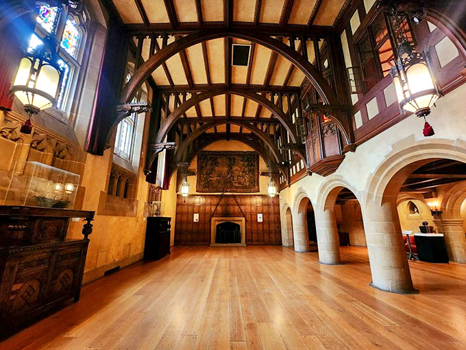 This magnificent hall features soaring ceilings and intricate woodwork that makes your living room look like it was decorated by a toddler with crayons.