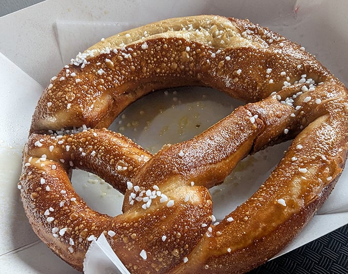 The jumbo pretzel arrives golden-brown and glistening with salt crystals &ndash; carbs in their most glorious form, ready for dipping.