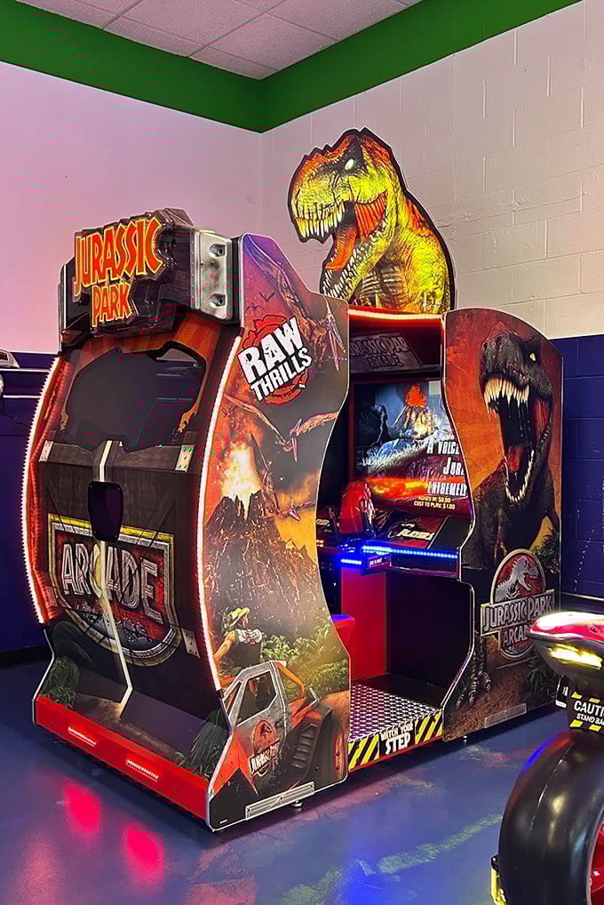 The Jurassic Park arcade cabinet roars with prehistoric charm, daring brave souls to face digital dinosaurs without spilling their drinks.