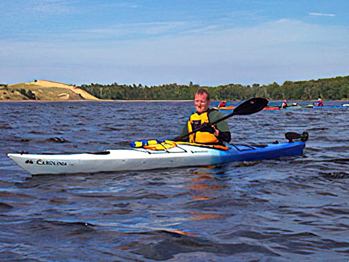 Childhood joy meets wilderness adventure as young explorers discover the freedom of open water paddling.