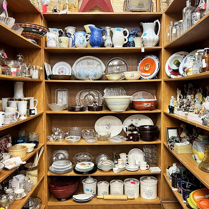Grandma's kitchen, meticulously organized by color and era &ndash; from jadeite mixing bowls to ceramic canisters that once held flour in kitchens past.
