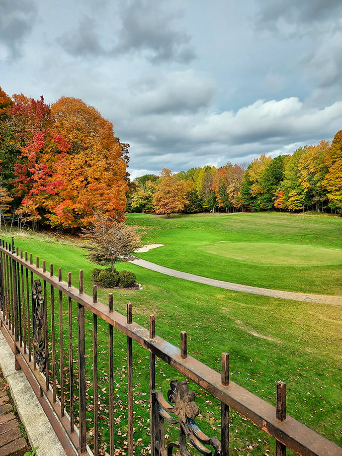 From the castle grounds, visitors can gaze across meticulously maintained lawns to the vibrant autumn foliage beyond.