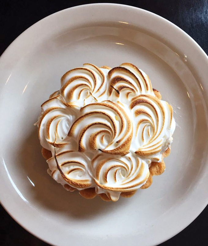 A lemon meringue tart crowned with perfectly toasted peaks of meringue &ndash; the sweet-tart balance that makes your taste buds do a happy dance.