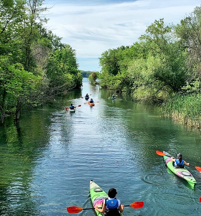 Kayakers paddle through Detroit's hidden waterways, discovering a peaceful side of the Motor City that few tourists ever experience.
