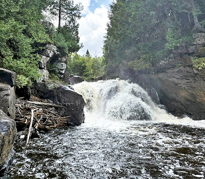 Nature's symphony: The main waterfall creates a thunderous soundtrack as it plunges into the churning pool below.