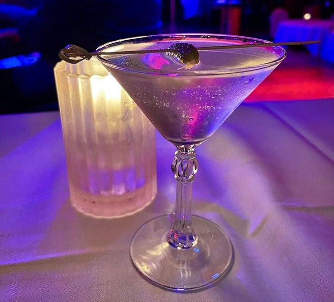 This isn't just a martini – it's liquid history in a glass so perfectly chilled it practically shivers with anticipation.