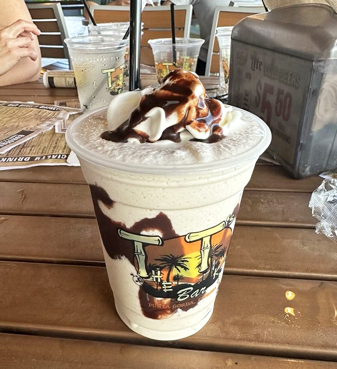 The Mudslide: where dessert meets cocktail in a frosty romance. Chocolate drizzle flirts with creamy goodness in this cup of pure indulgence.