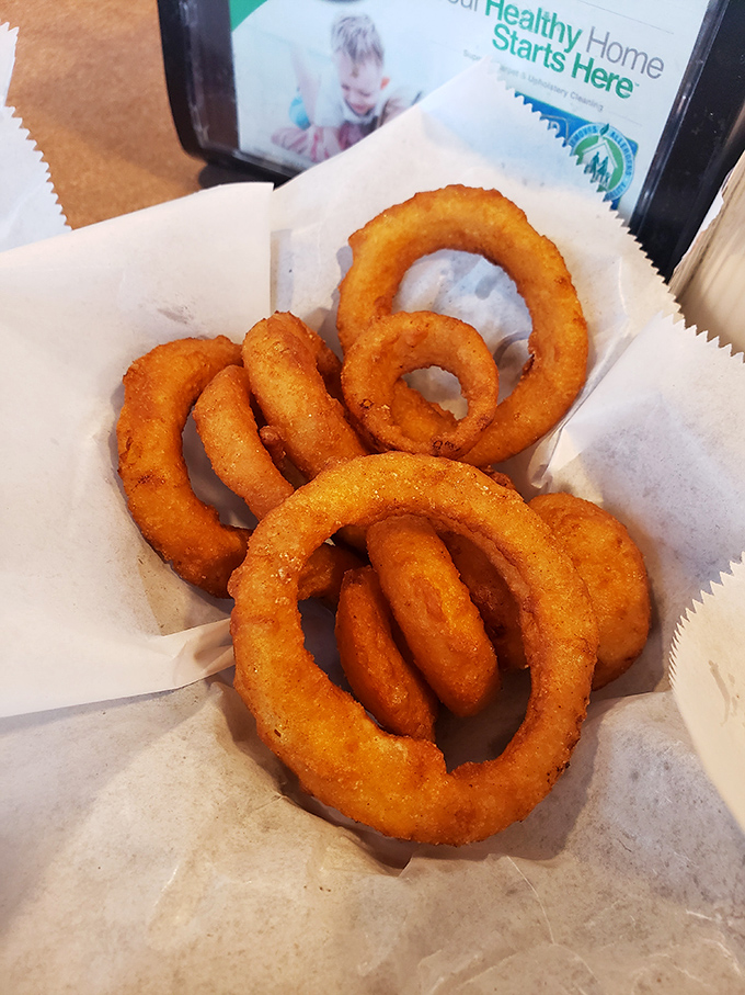 Onion rings with that perfect crunch-to-tender ratio &ndash; each golden hoop shatters satisfyingly between your teeth before revealing its sweet interior.