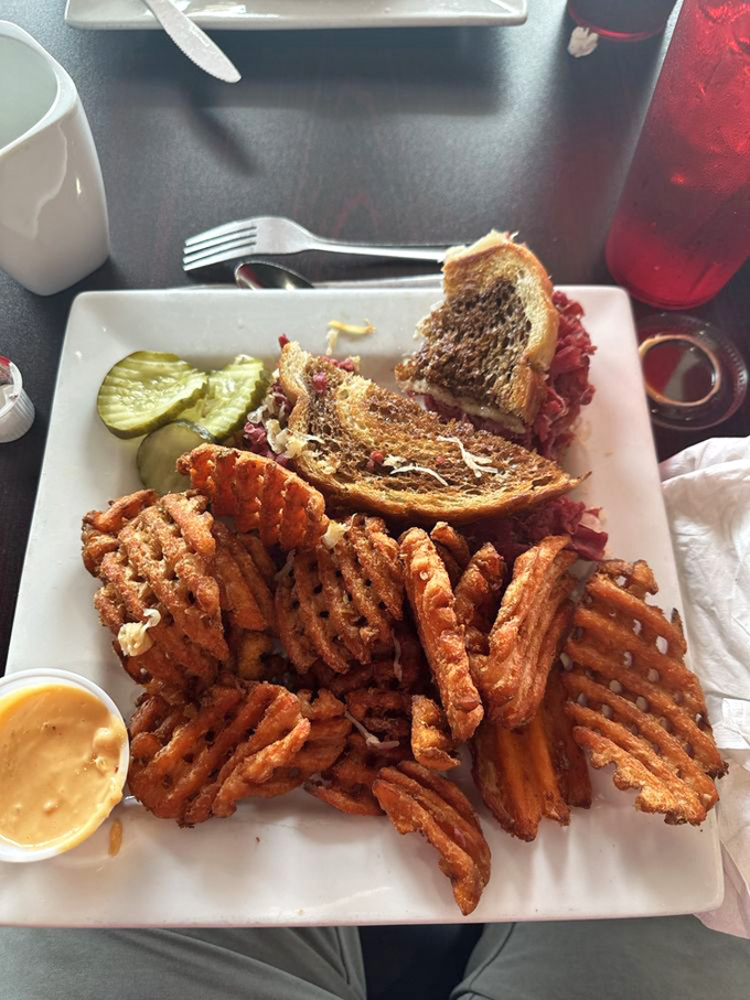 The Reuben sandwich with sweet potato waffle fries – where lunch crashes breakfast's party and nobody minds one bit.