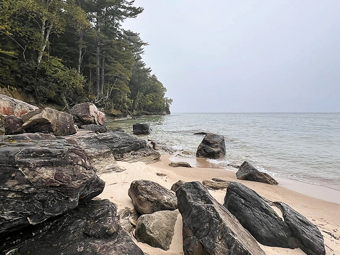 Ancient rocks stand sentinel along the shoreline, witnesses to centuries of Lake Superior's moods and Michigan's changing seasons.