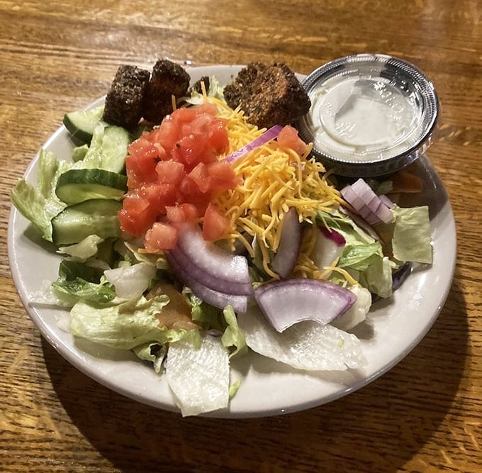 A fresh garden salad for those pretending they came for something healthy before demolishing dessert.