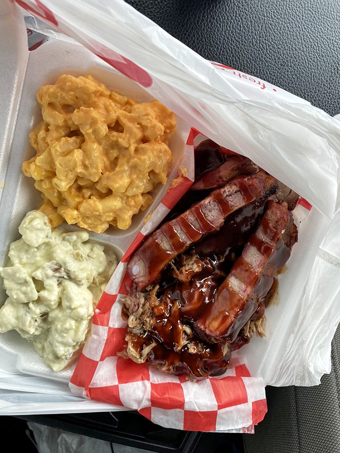 This barbecue sampler plate isn't just food – it's a meaty United Nations where different proteins gather in peaceful, delicious harmony.