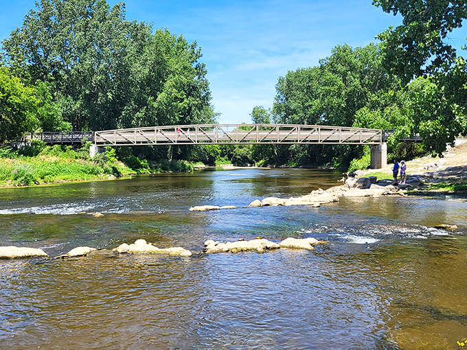 The Shiawassee River flows through town like liquid tranquility, inviting you to slow down and match its unhurried pace.