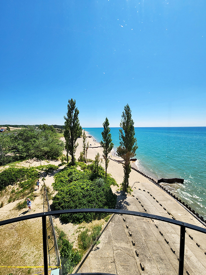 An aerial view reveals Point Betsie's strategic position, with protective breakwaters creating a distinctive shoreline pattern.