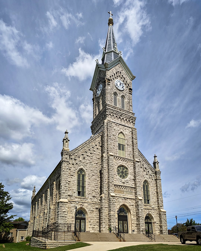 St. Mary's Church tower reaches skyward with stone-solid faith, its clock keeping time for generations of worshippers and wayward sailors.