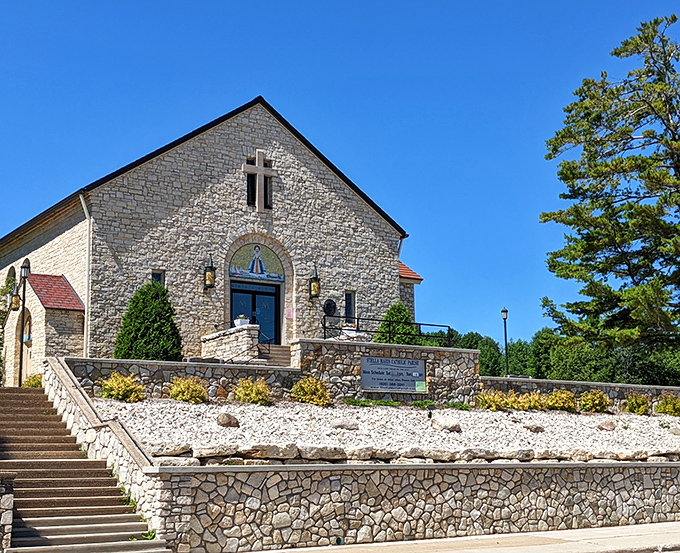 Stella Maris Catholic Church's limestone fa&ccedil;ade and grand staircase reach skyward &ndash; architectural spirituality carved from Door County's bedrock.