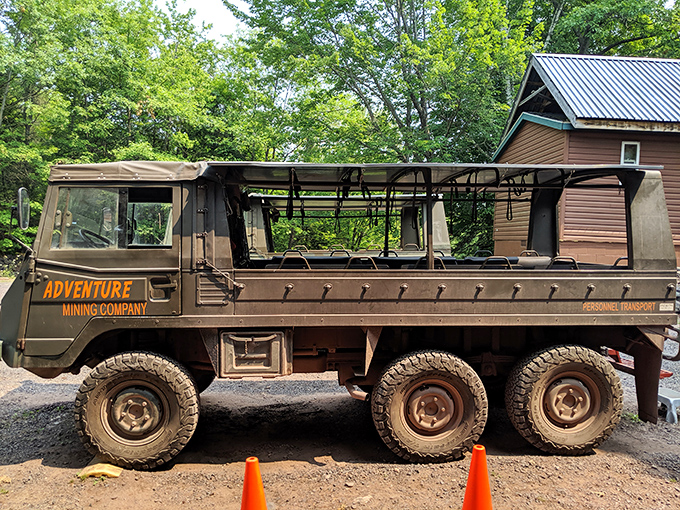The Steyr-Puch Pinzgauer, Adventure Mining Company's rugged chariot, ready to transport thrill-seekers to their subterranean destiny.