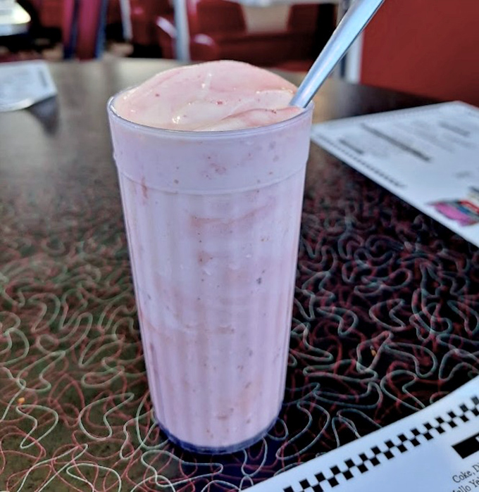 This strawberry milkshake isn't just thick – it's practically a structural engineering marvel that requires serious straw commitment.