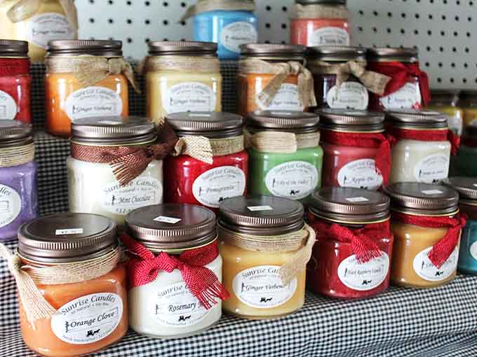 Handcrafted candles line the shelves, offering visitors a chance to take home scents that evoke memories of their bakery visit.