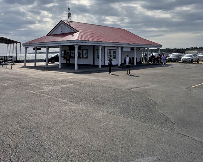 The charming ticket office, with its distinctive red roof and white columns, serves as the gateway to your swashbuckling adventure on Mackinac Island.