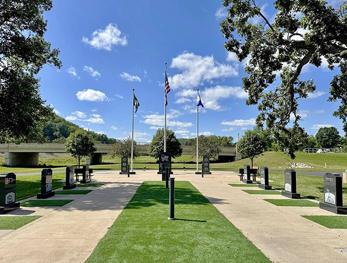 The Veterans Memorial Park stands in solemn tribute, flags dancing in the breeze above granite monuments that remind us freedom isn't free.