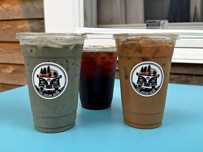 A trio of specialty drinks showcasing the range, from matcha green to cold brew to classic iced coffee, each one Instagram-ready.