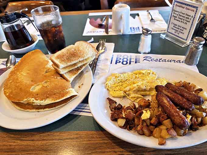 Classic American breakfast done right - eggs, toast, hash browns, and sausage arranged like old friends at a delicious reunion.