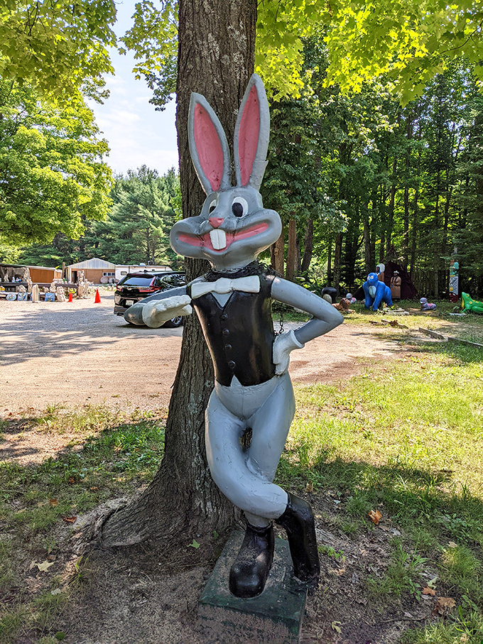 "What's up, Doc?" This dapper rabbit leans casually against a tree, looking like he's waiting for his woodland blind date.