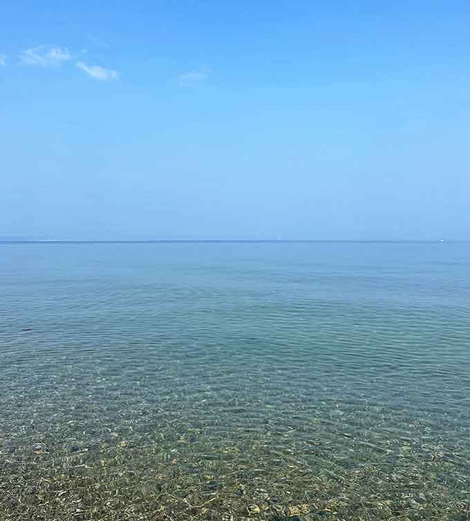 The water's so clear you'd think someone installed glass &ndash; Lake Michigan showing off its transparency at Van's Beach.