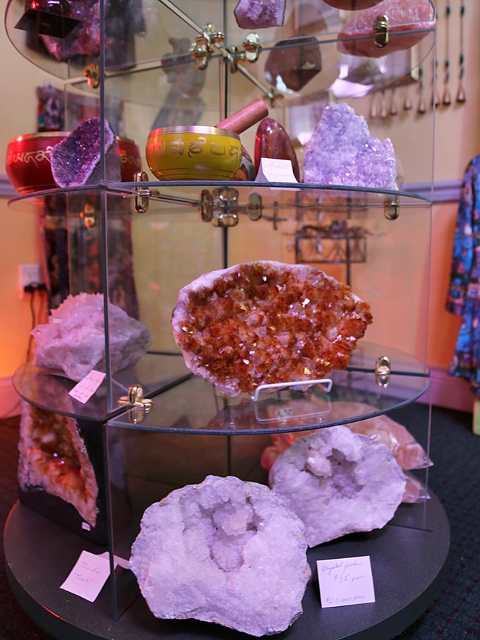 Crystal specimens catch the light in their glass home, each one telling a geological story millions of years in the making.