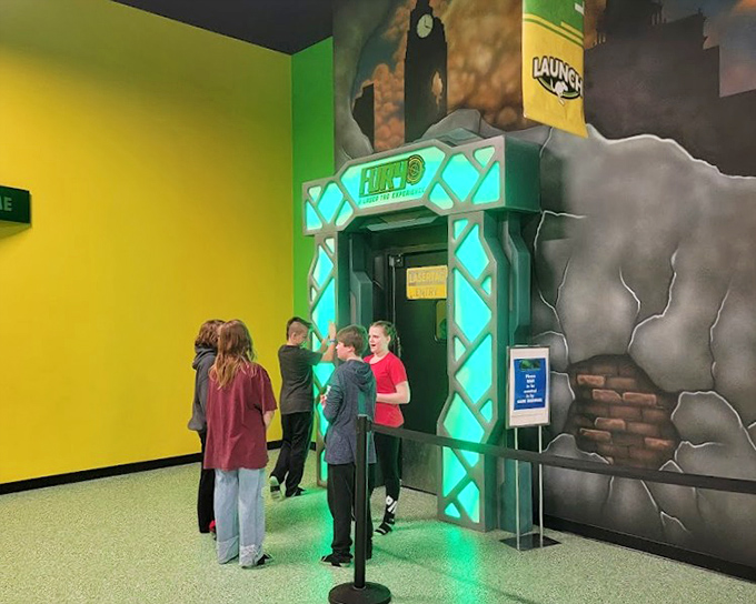 The entrance to Laser Tag promises high-tech battles in a neon-lit arena. Strategy matters, but giggling uncontrollably ruins your stealth approach.