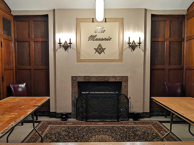 The Masonic emblem proudly displayed above this fireplace reminds visitors of the building's original purpose and continuing legacy.