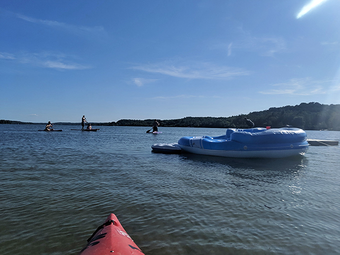 Water toys await their next adventure – that blue raft has probably carried more laughing children and relaxing adults than anyone could count.