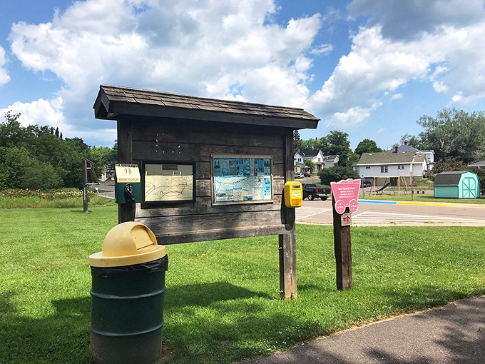 The trail's rustic information kiosk stands ready, like a woodland professor waiting to share secrets of iron, sweat, and transformation.
