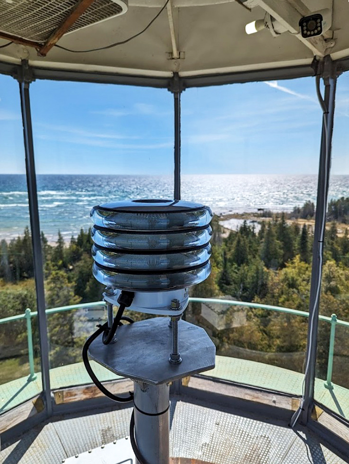 Inside the lantern room, maritime technology meets artistry in the Fresnel lens system that has guided ships safely for generations.
