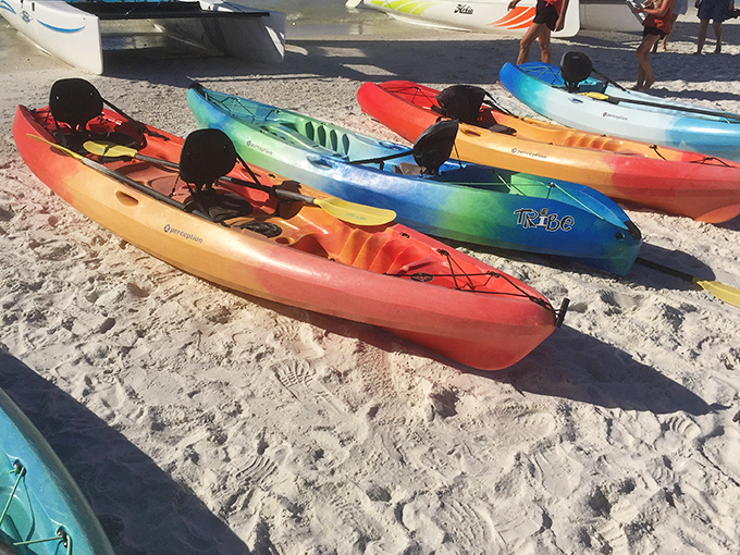 Colorful kayaks wait patiently for adventurers, each one promising a different story on Marco's crystal waters.