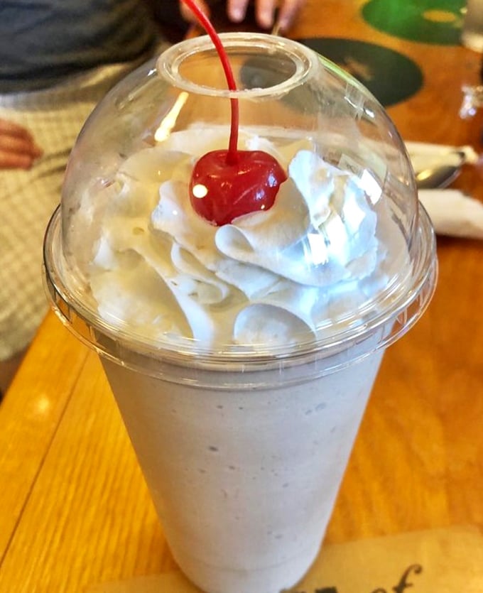 The milkshake that time forgot&mdash;thick enough to require serious straw commitment, crowned with whipped cream and that essential cherry.