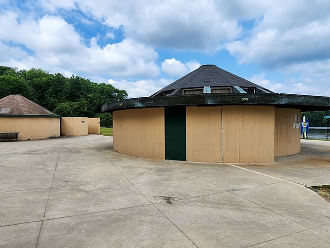 The humble pavilion stands ready to shelter sunburned warriors taking a break from their inflatable conquests.