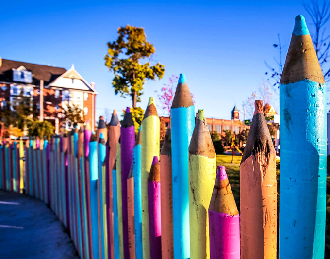 The pencil fence creates a rainbow border that would make any art teacher proud, standing tall like colorful guardians of creativity.