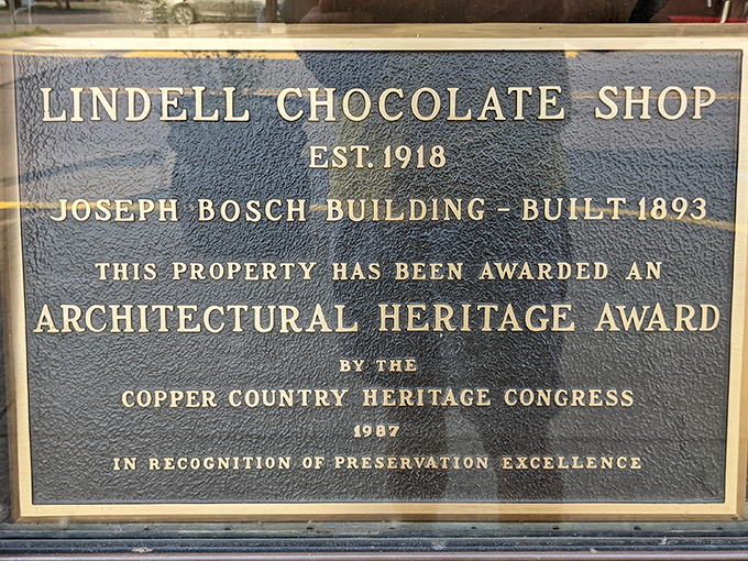 The plaque tells the official story, but the real history of Lindell's is written in chocolate, conversation, and community connections.