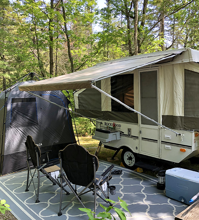 Camping with character: This pop-up camper creates an instant home-away-from-home under the protective canopy of Michigan's northern forests.