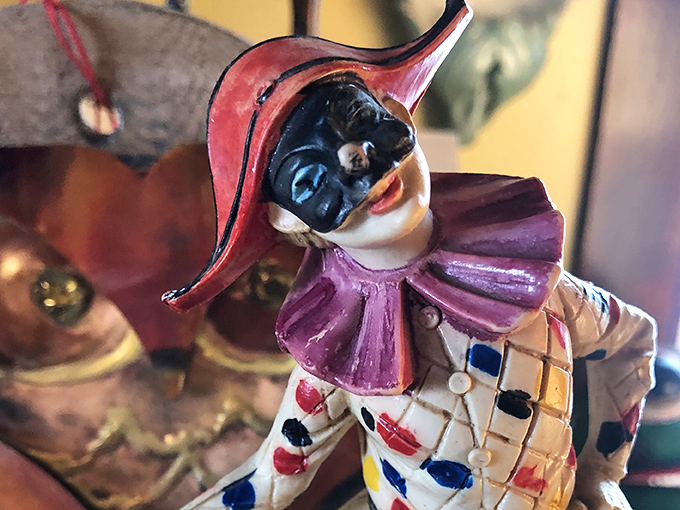 This vintage Harlequin jester figurine seems to be laughing at a joke only he understands &ndash; and maybe that's for the best.