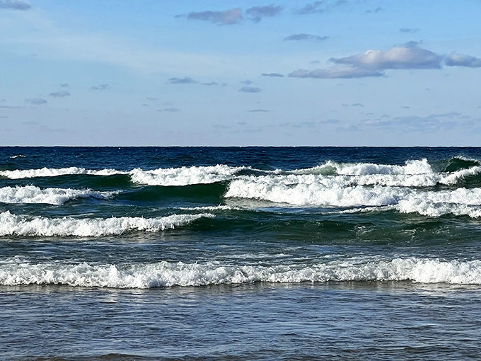 Lake Michigan's moody blues: Waves dance their way to shore, performing a timeless rhythm that soothes the soul.