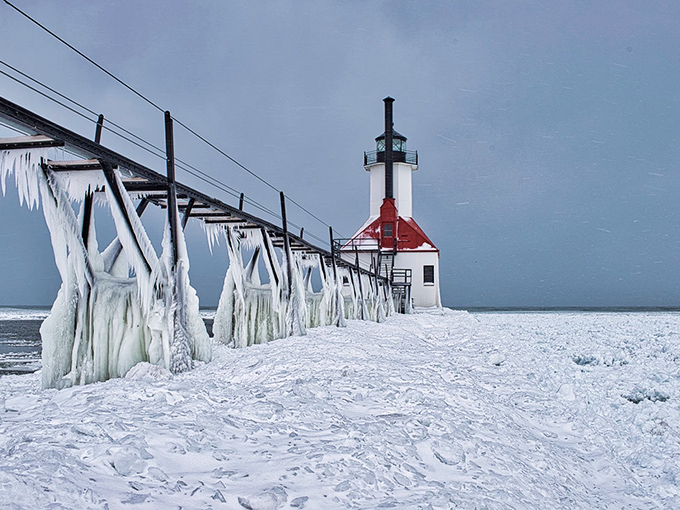 Winter transforms the lighthouse into a frozen fantasy world, where ice sculptures created by nature put human artists to shame.