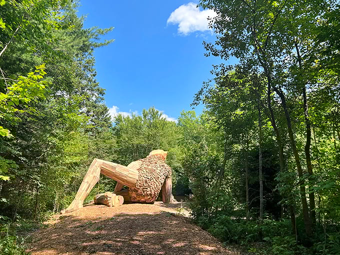 From behind, Benny's wooden "scales" reveal the painstaking construction process, each piece carefully positioned to create the flowing form.