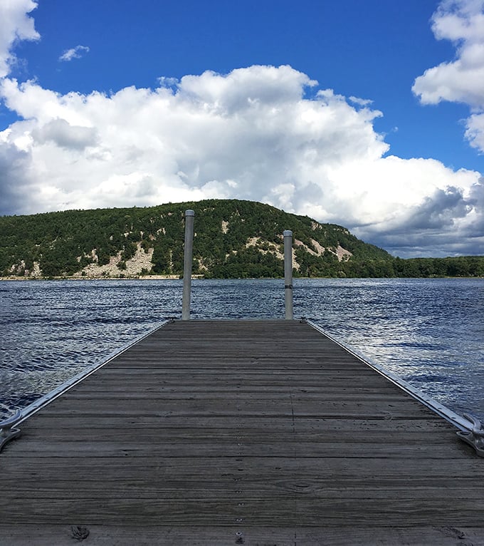 A wooden dock stretches toward adventure, inviting visitors to pause and soak in the majesty of Wisconsin's most beloved state park.