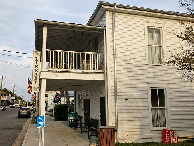 The Cedar Key Public Library stands as a testament to simpler times, when buildings had porches and books were the original social network.